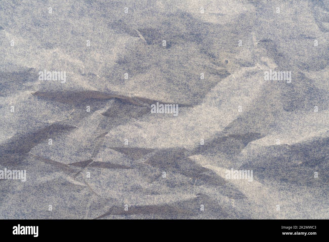 crumpled paper on a blue surface Stock Photo - Alamy