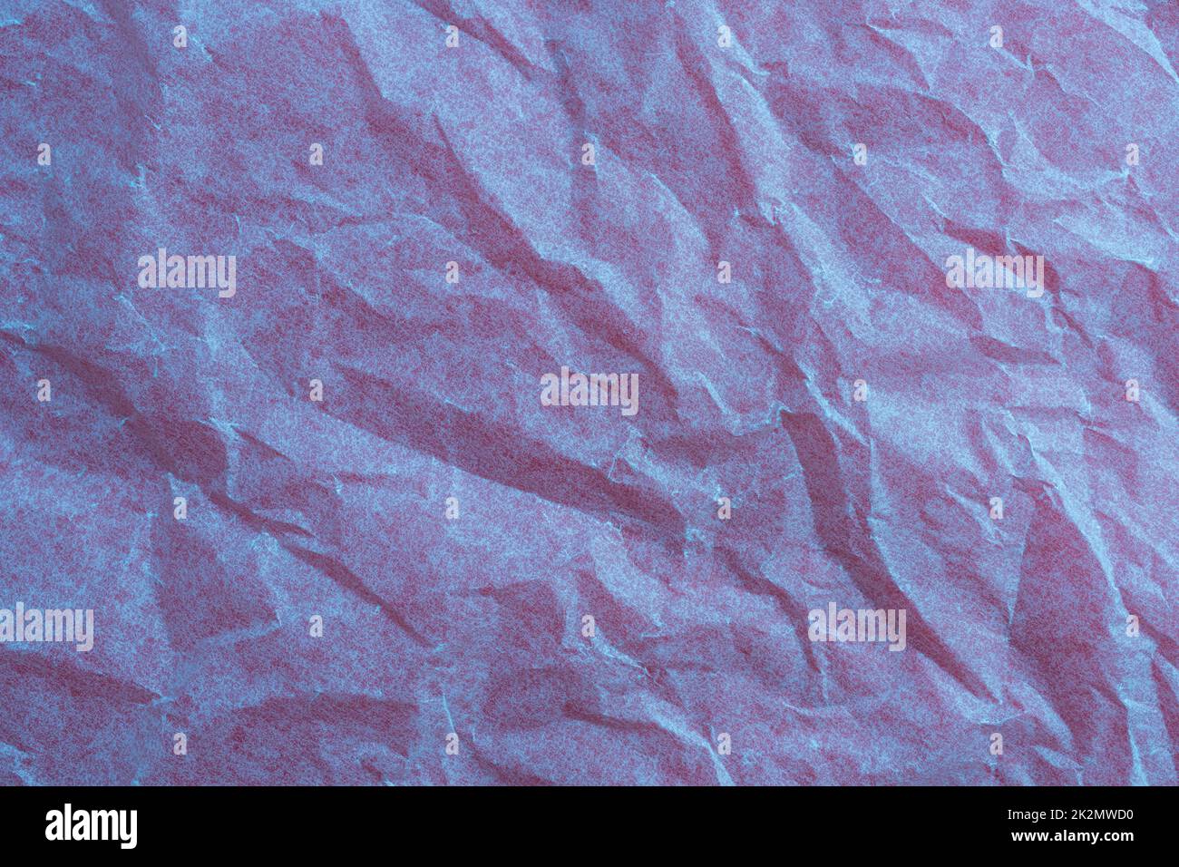 crumpled paper on a red surface Stock Photo - Alamy