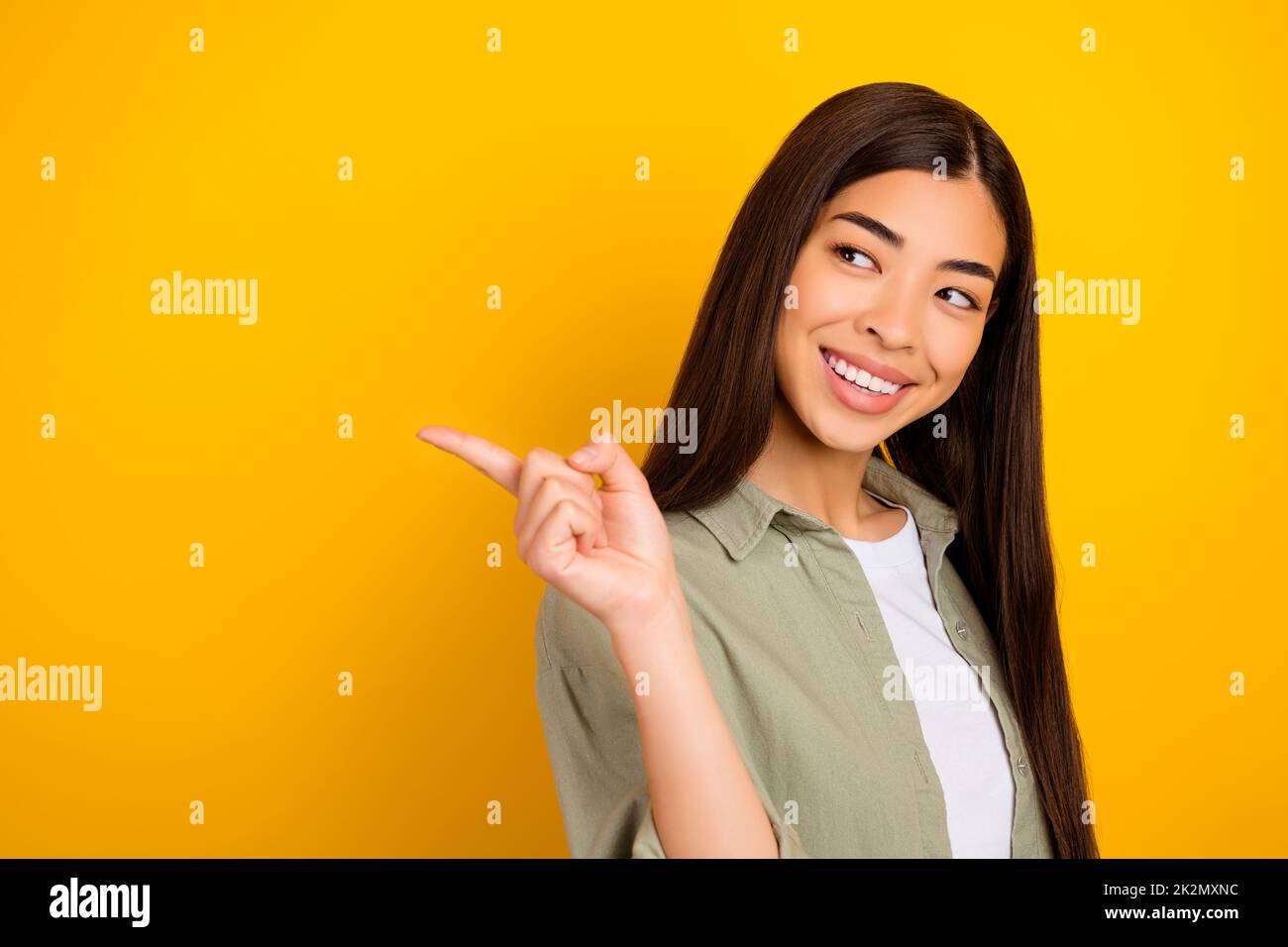 Photo of good mood young female promote her haircare products isolated ...