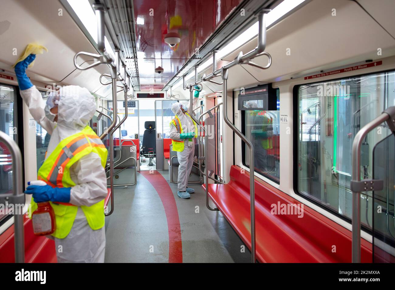 Workers in clean suits sanitizing subway Stock Photo - Alamy
