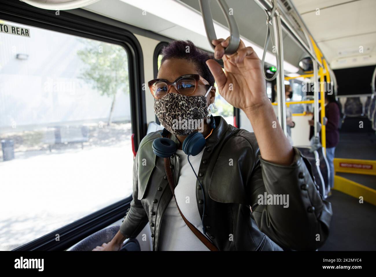 Bus woman standing hi-res stock photography and images - Alamy
