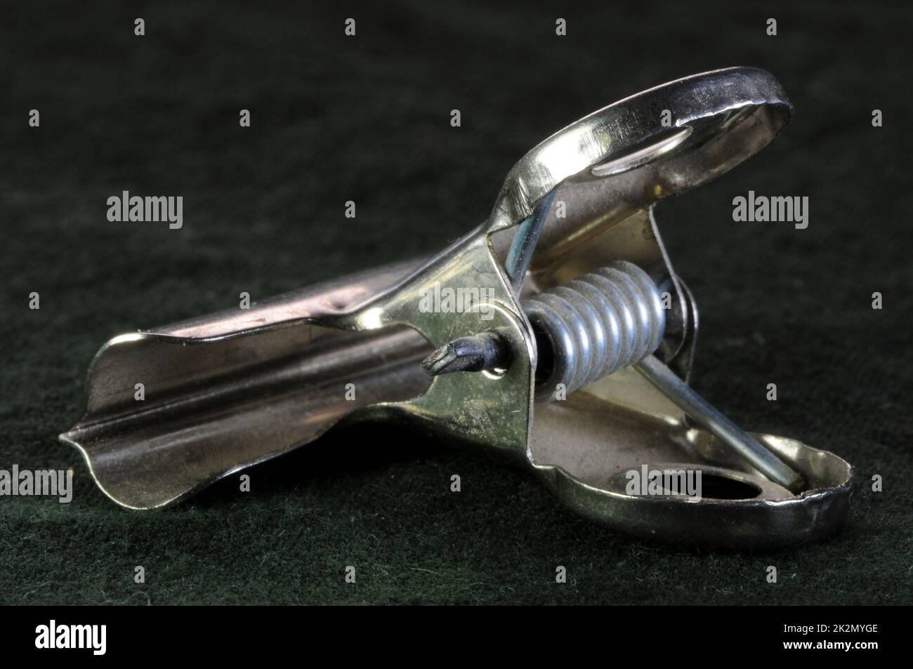 Bulldog type stainless steel paper clip Stock Photo - Alamy