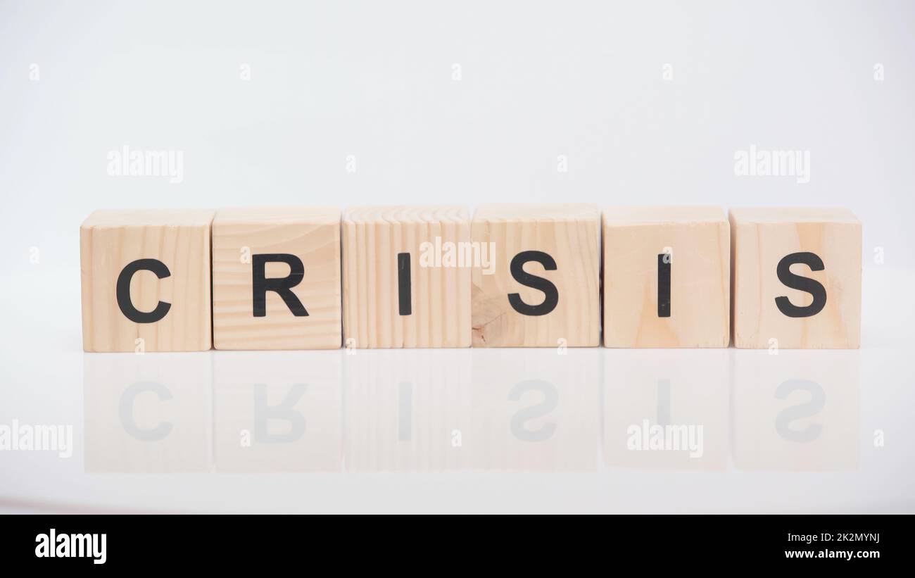 wooden cubes with crisis lettering on white background Stock Photo - Alamy