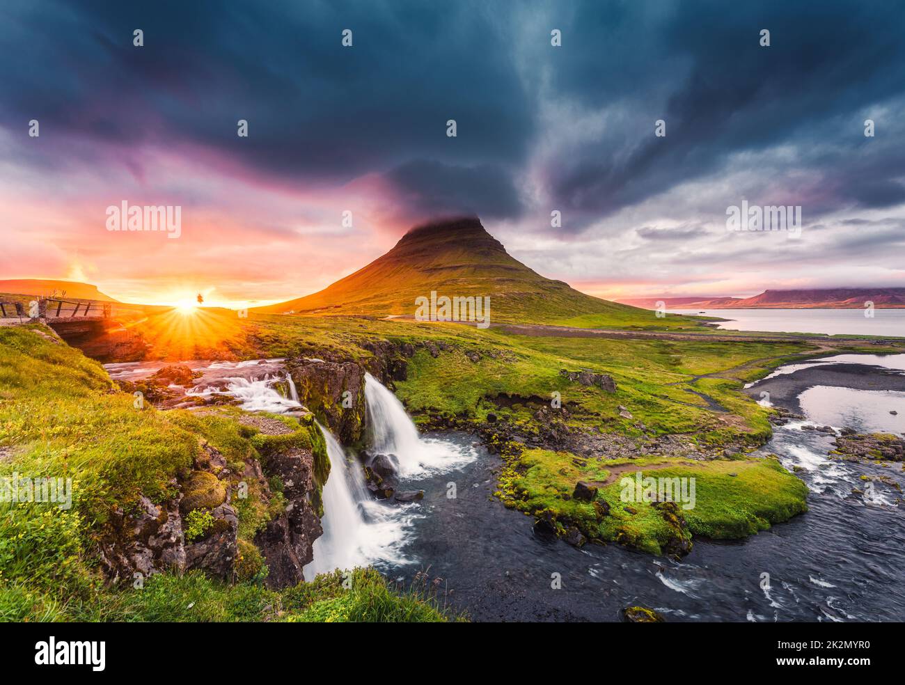 Fantastic landscape of sunset over Kirkjufell mountain with ... Fantastic landscape of sunset over Kirkjufell mountain with ...