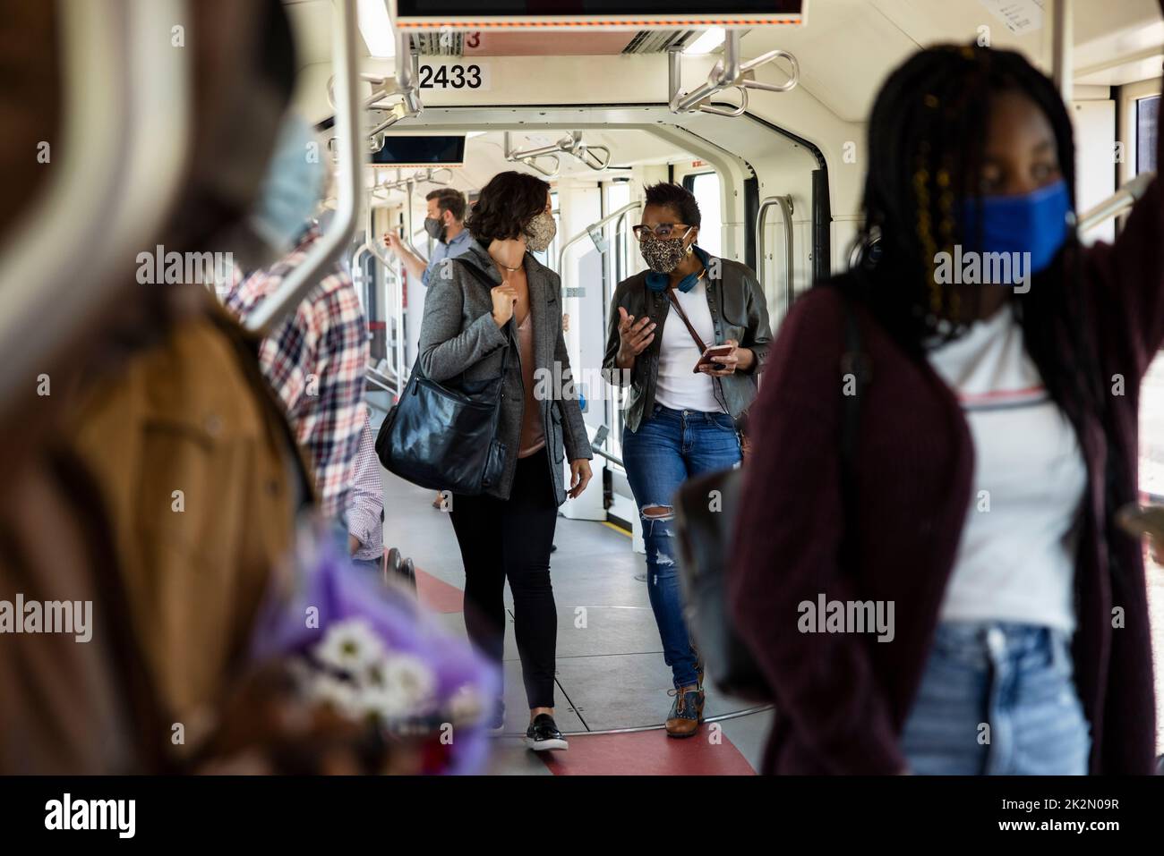 Passengers talking commuter train hi-res stock photography and images ...