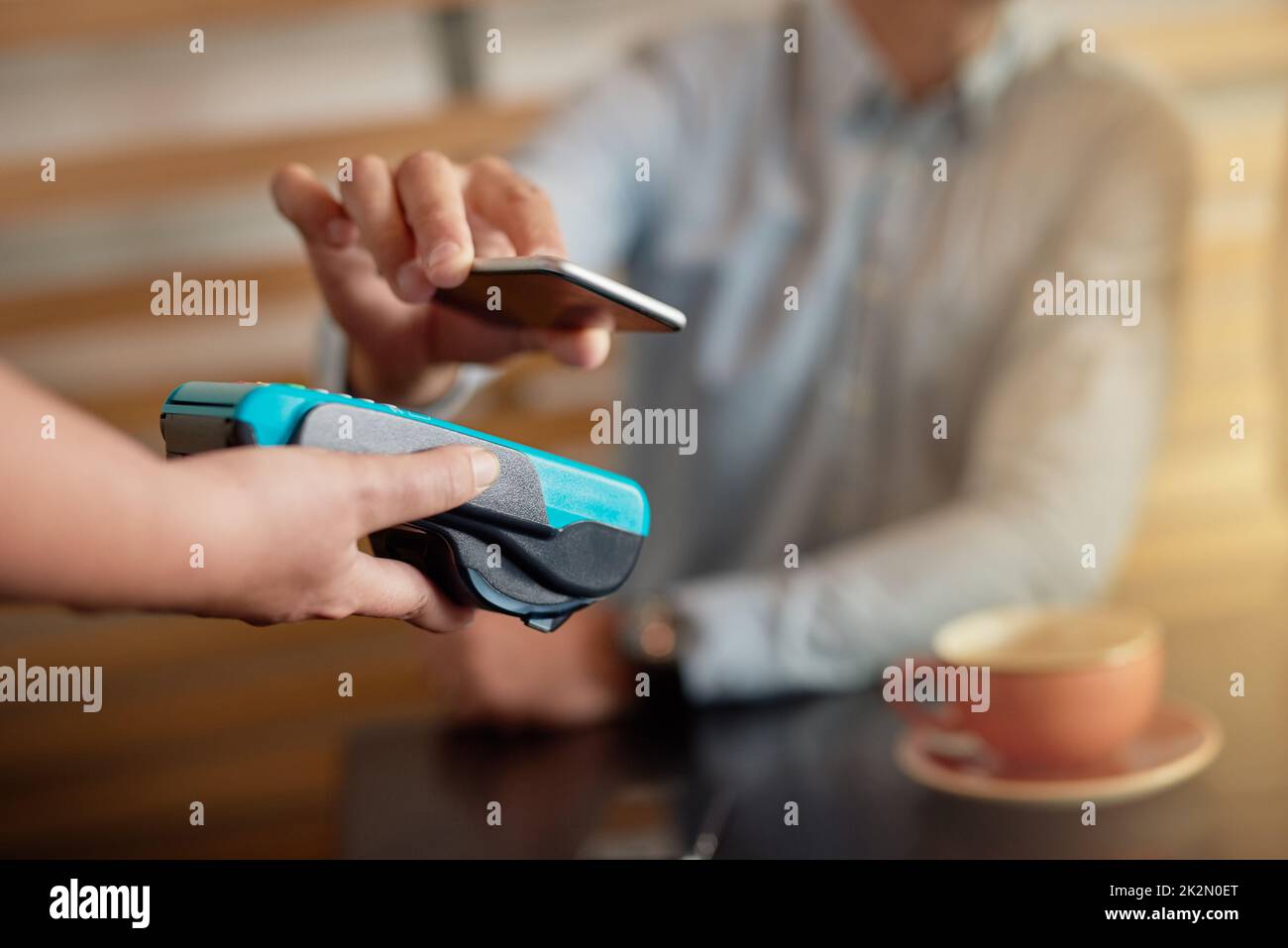Simple, smart and so easy. Shot of a man making a payment with his ...