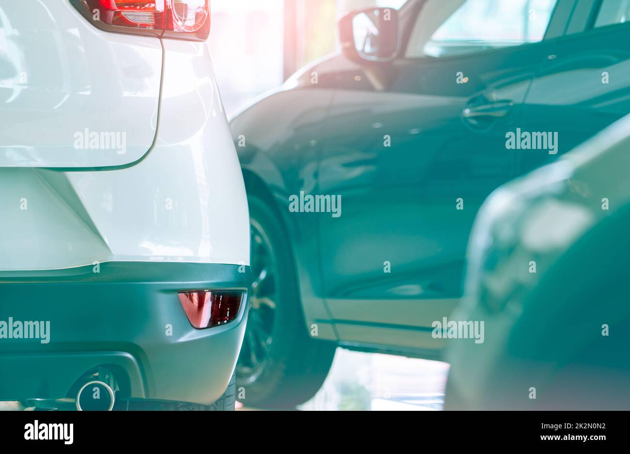Rearview car parked in luxury showroom. Car dealership office. New car ...