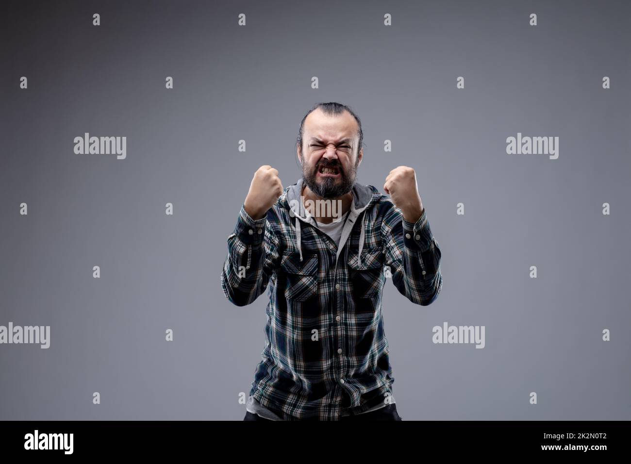 Man gnashing of teeth hi-res stock photography and images - Alamy