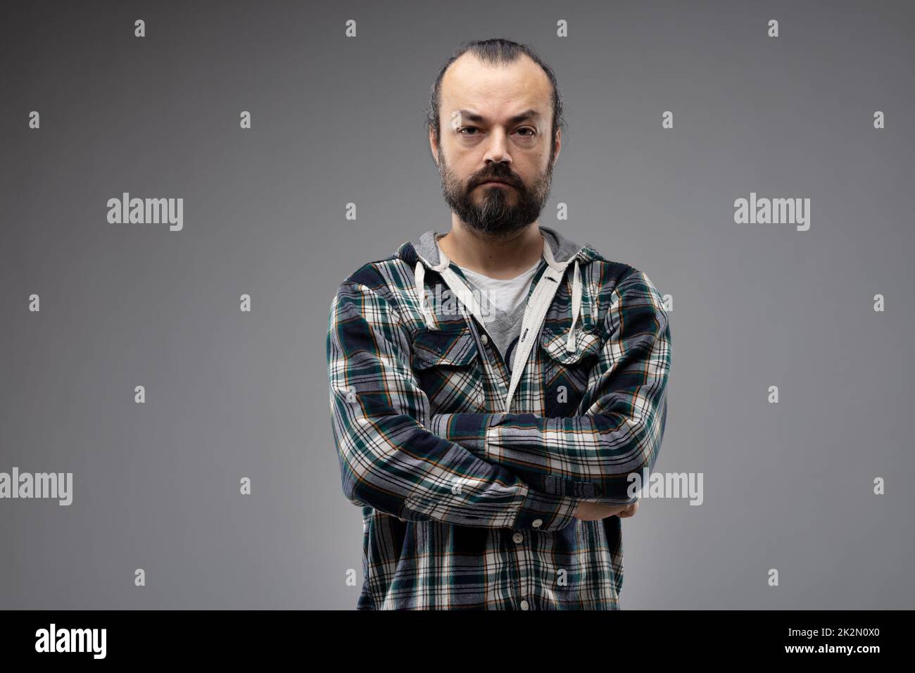Front portrait of serious man with crossed arms Stock Photo - Alamy