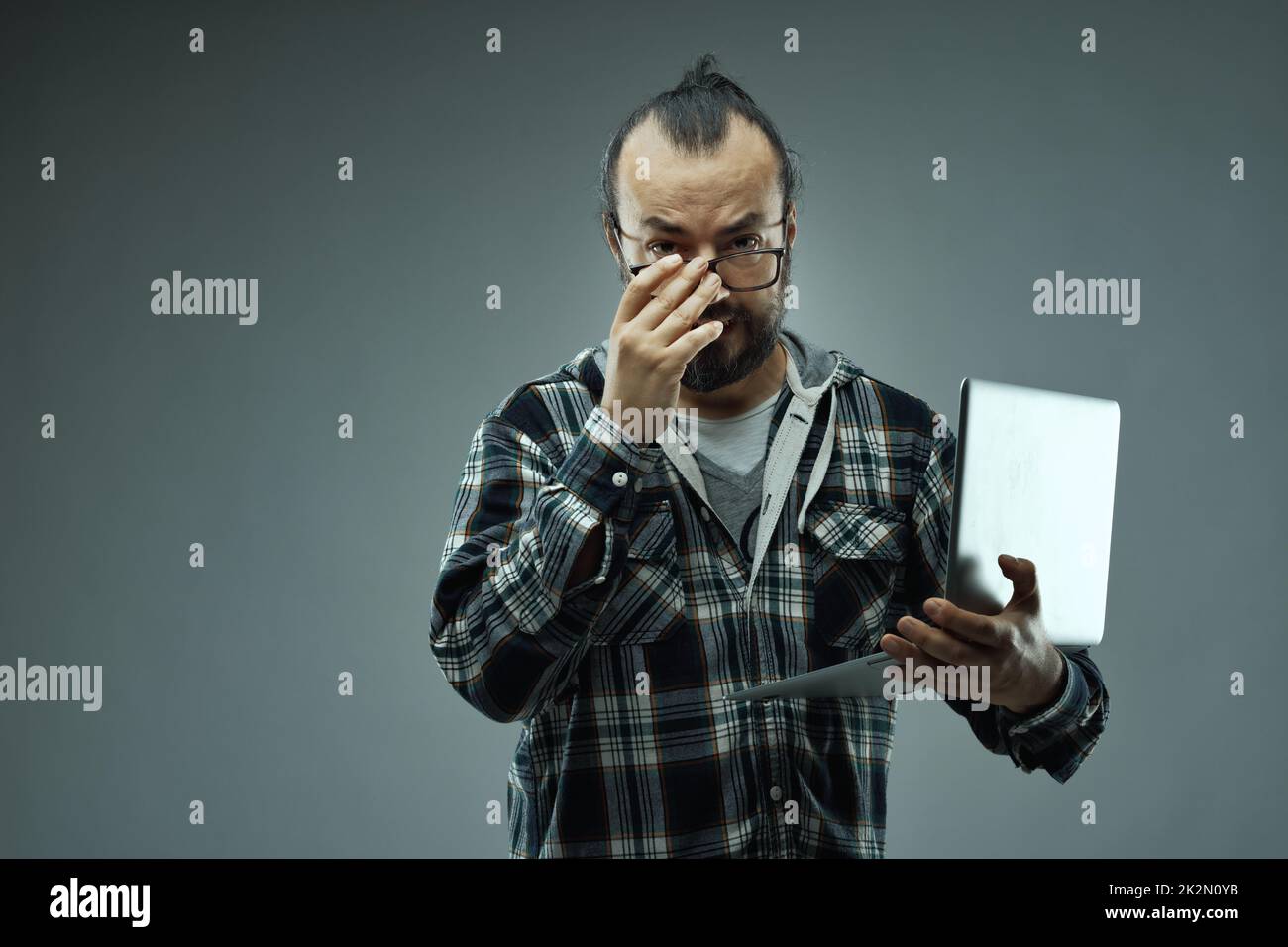 Clever intellectual man peering over his glasses at the camera Stock ...