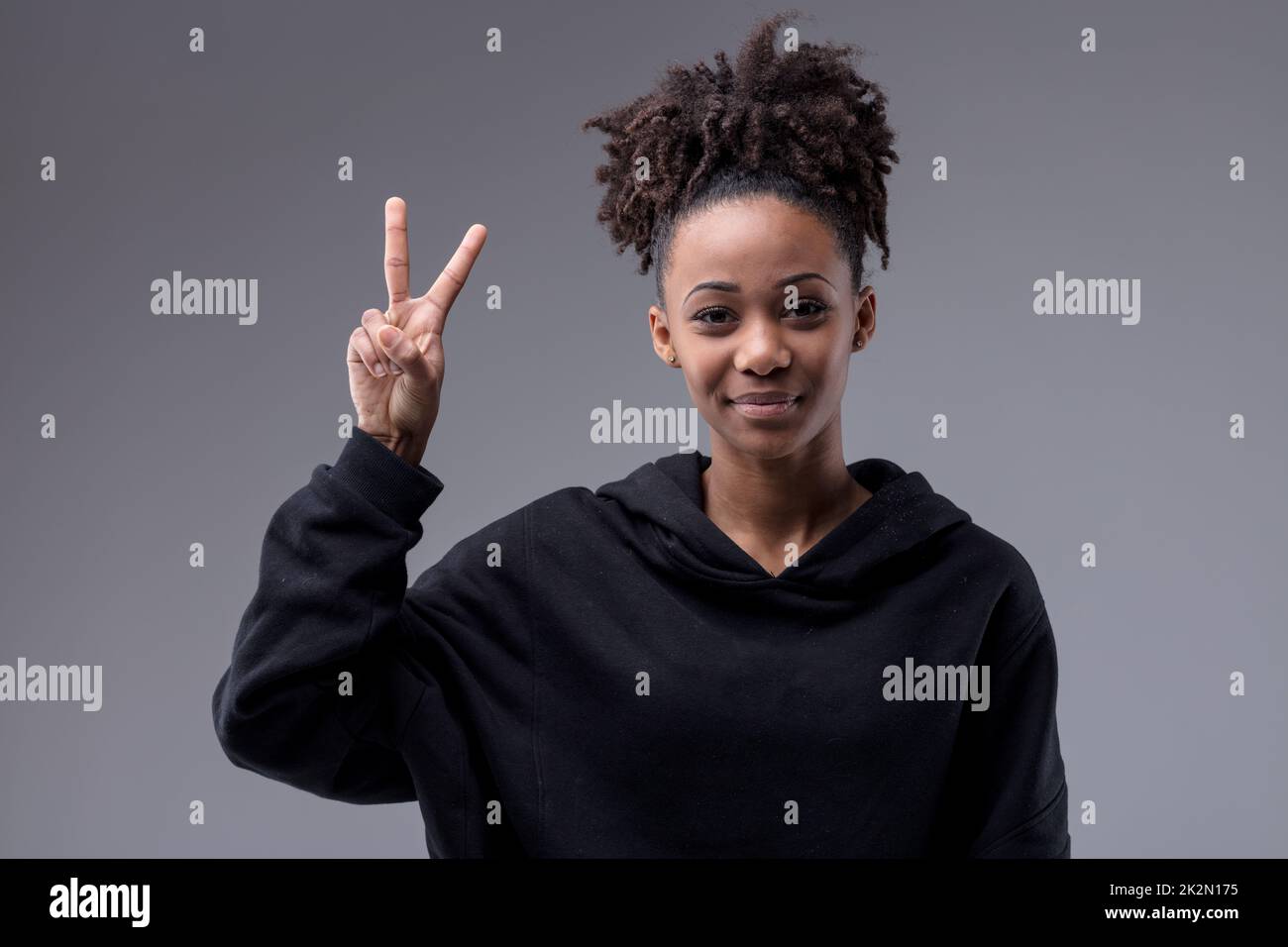Victory sign woman hi-res stock photography and images - Alamy