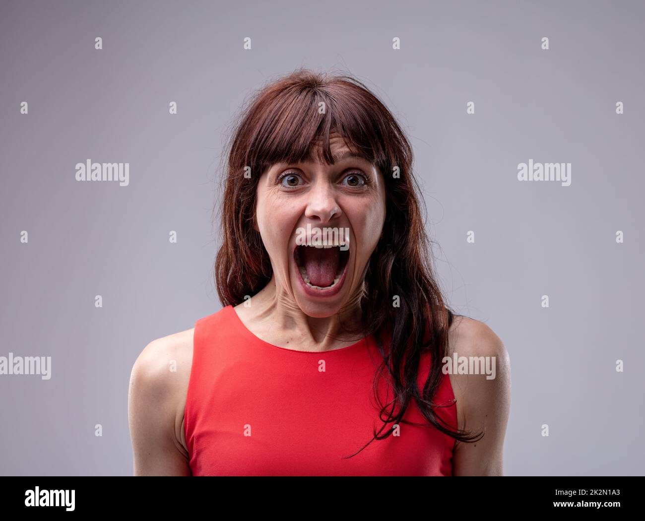 Excited exuberant woman standing screaming Stock Photo - Alamy Excited exuberant woman standing screaming Stock Photo - Alamy