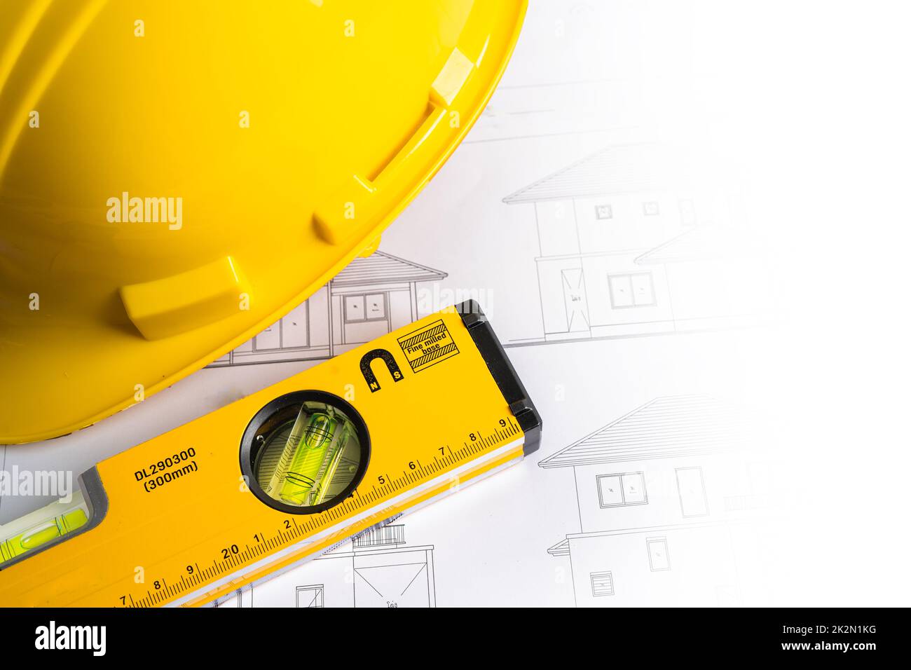 Architectural house plan project blueprint with yellow helmet and ...