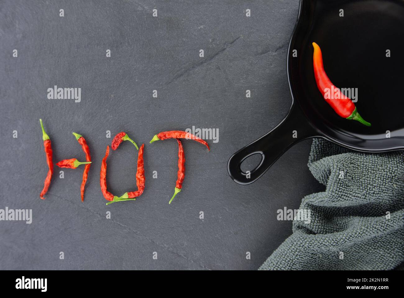 HOT spicy chili pepper still life with text Stock Photo - Alamy