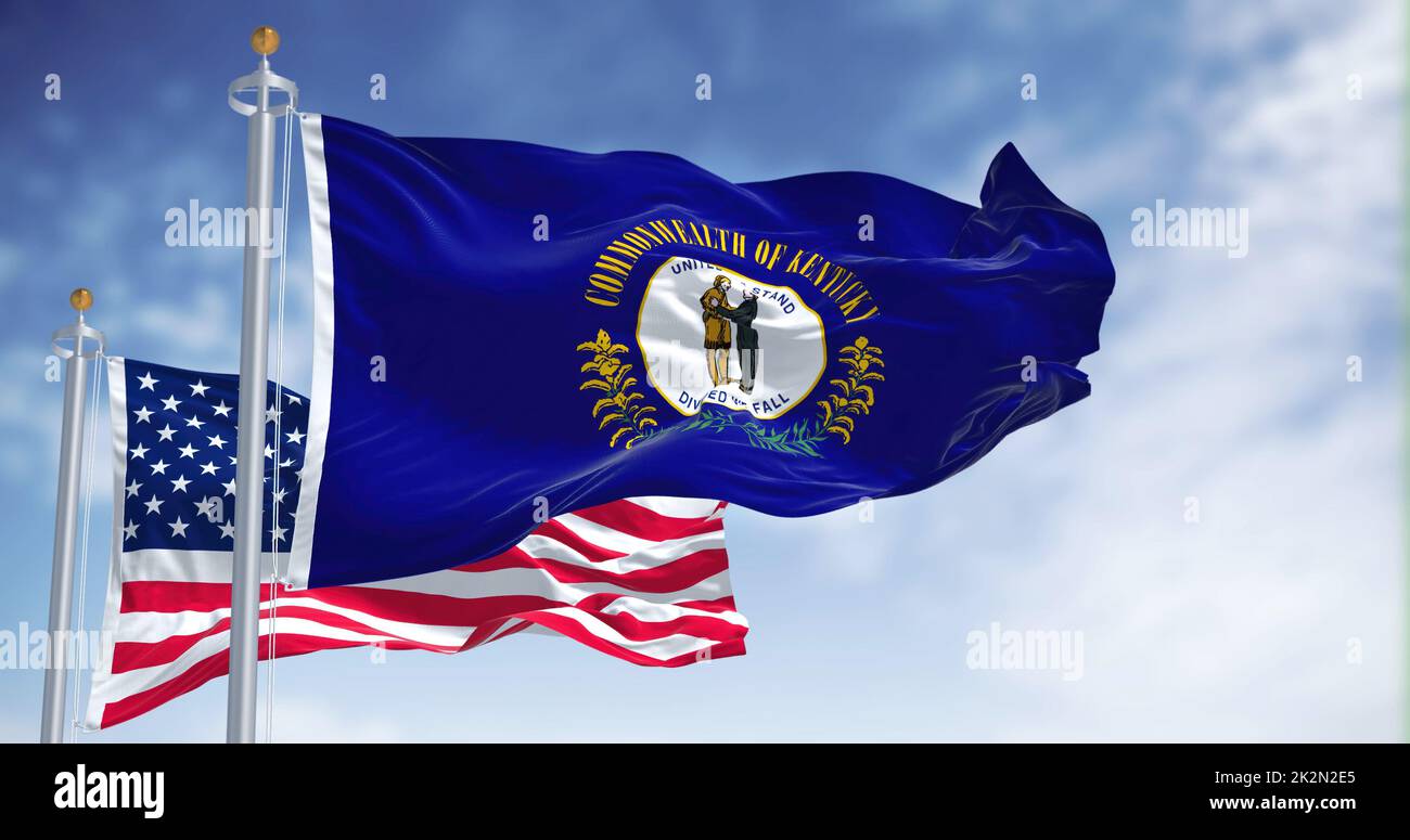 The Kentucky state flag waving along with the national flag of the ...