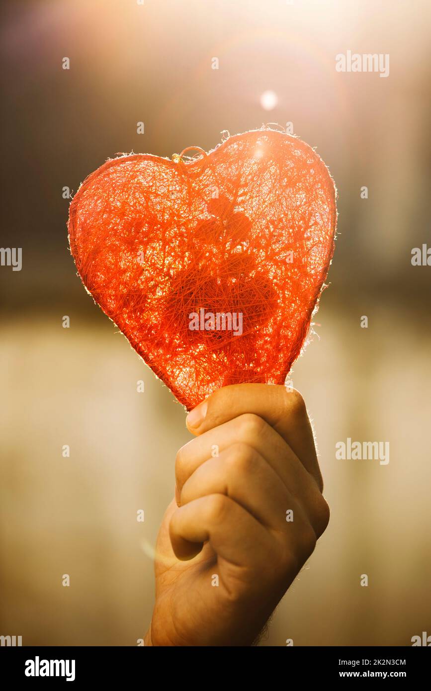 Hand holding heart sky hi-res stock photography and images - Alamy