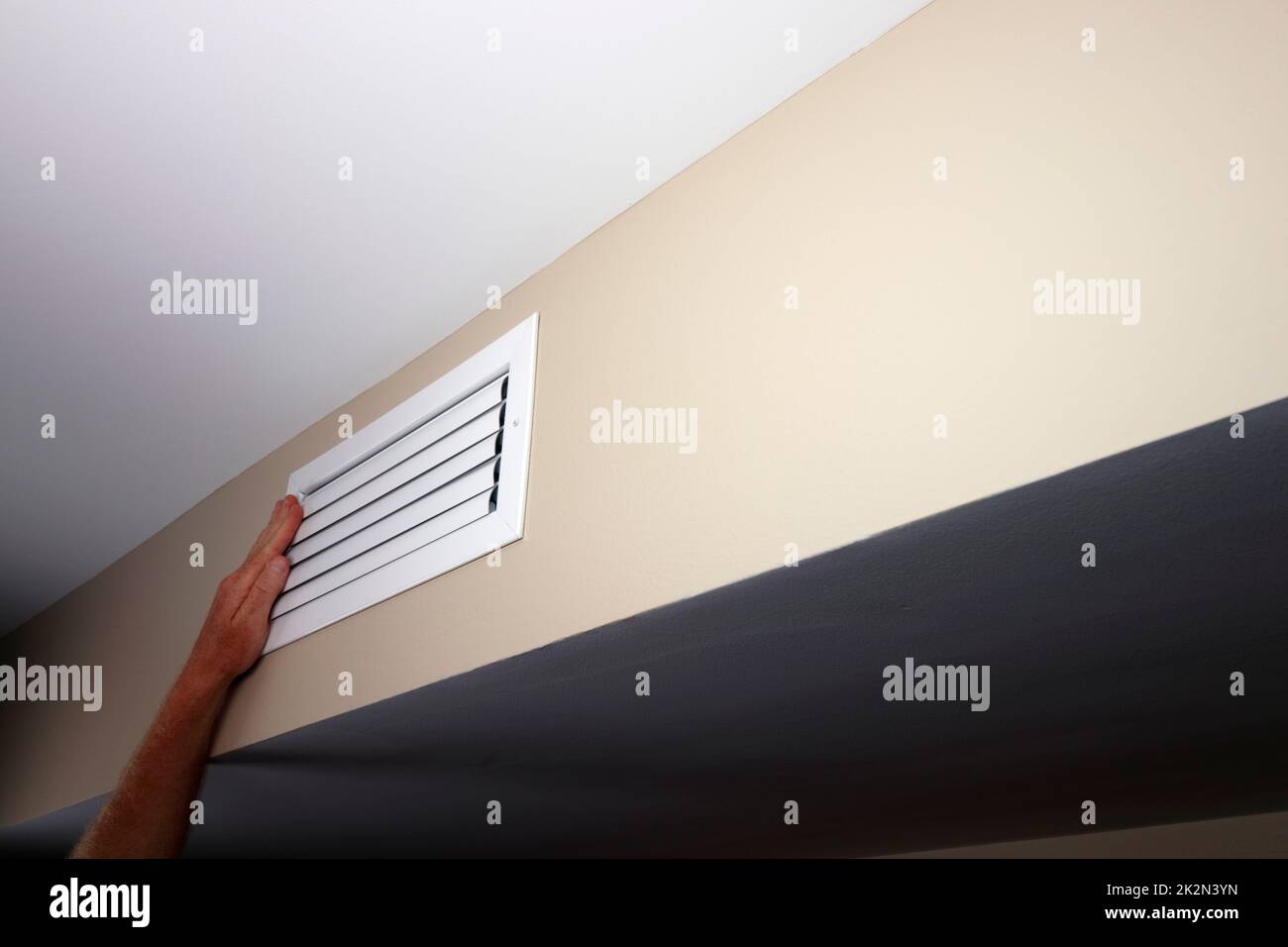 One Left Hand on a Closed White Rectangle Wall Air Duct Vent Stock ...