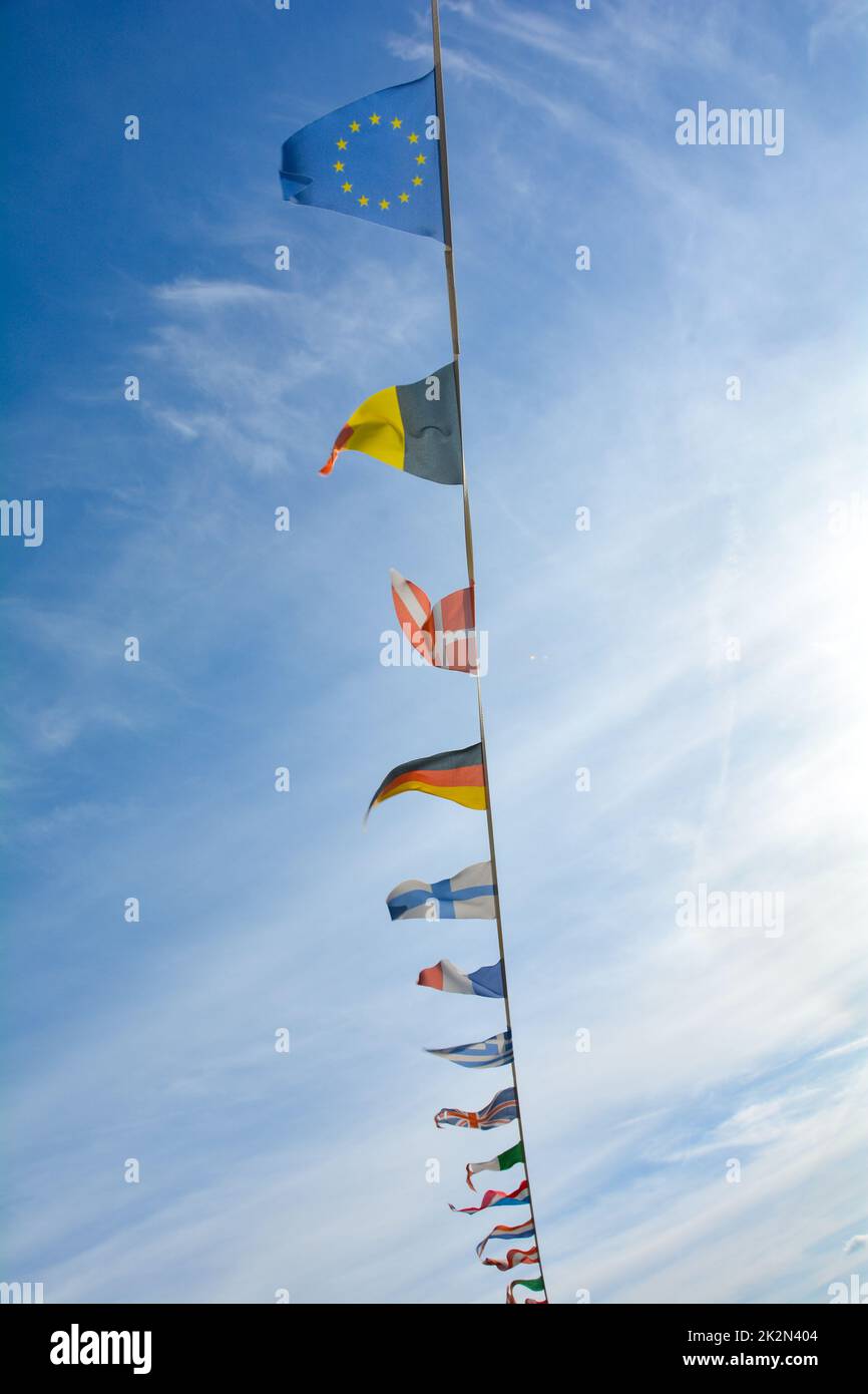 Flags from several countries against a blue sky Stock Photo - Alamy