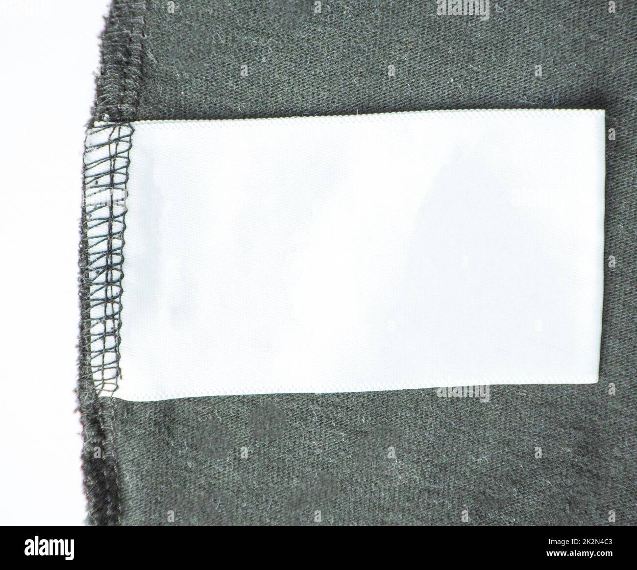 Empty empty clothing label for laundry information on the background of ...