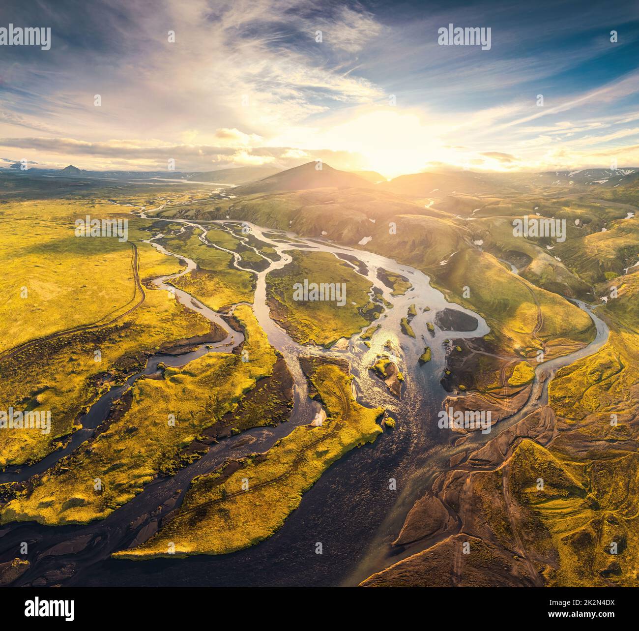 Aerial view of sunset over volcanic mountain and abstract glacier ...