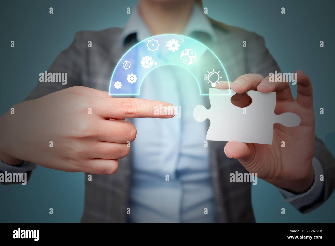 Lady in suit pointing puzzle piece representing innovative thinking ...