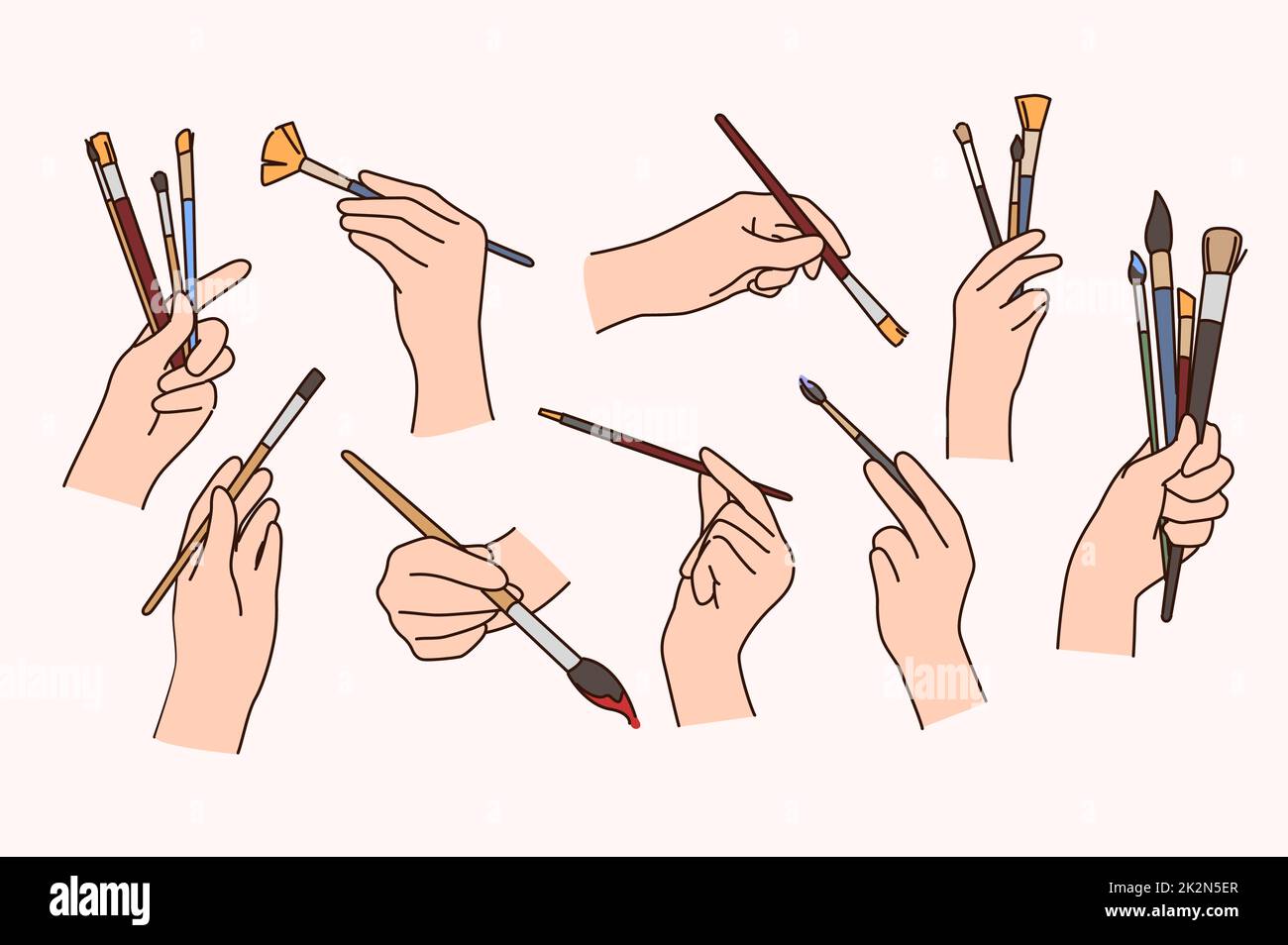 Set of person hands holding paint brushes Stock Photo - Alamy