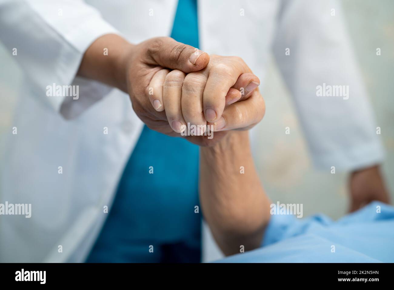 Holding hands Asian senior or elderly old lady woman patient with love, care, encourage and ...