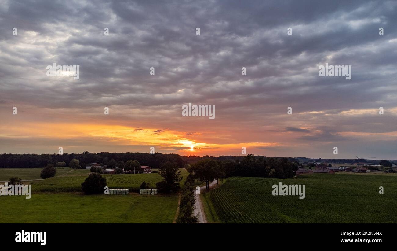 Sun Sunshine In Sunset Bright Sky. Beautiful Evening Sky Above Rural ...