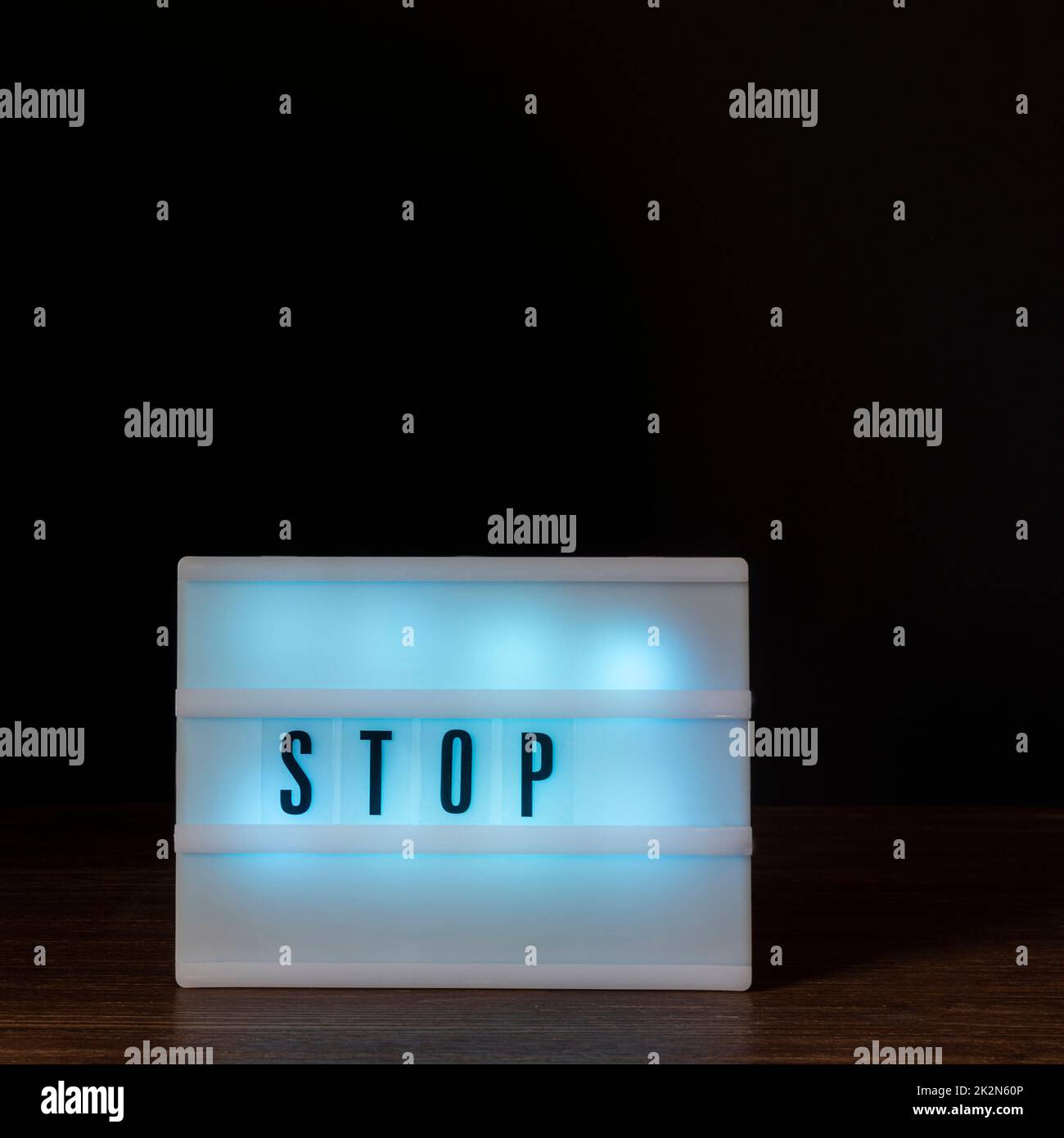 Stop illuminated sign Stock Photo - Alamy