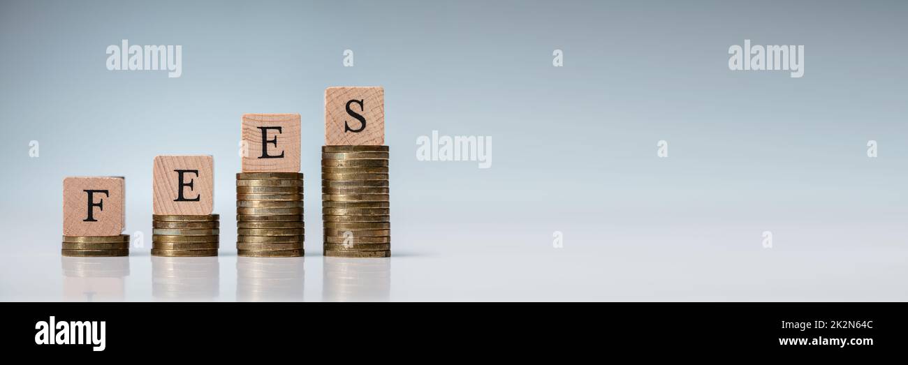 Fees On Increasing Coins Stacks Stock Photo - Alamy