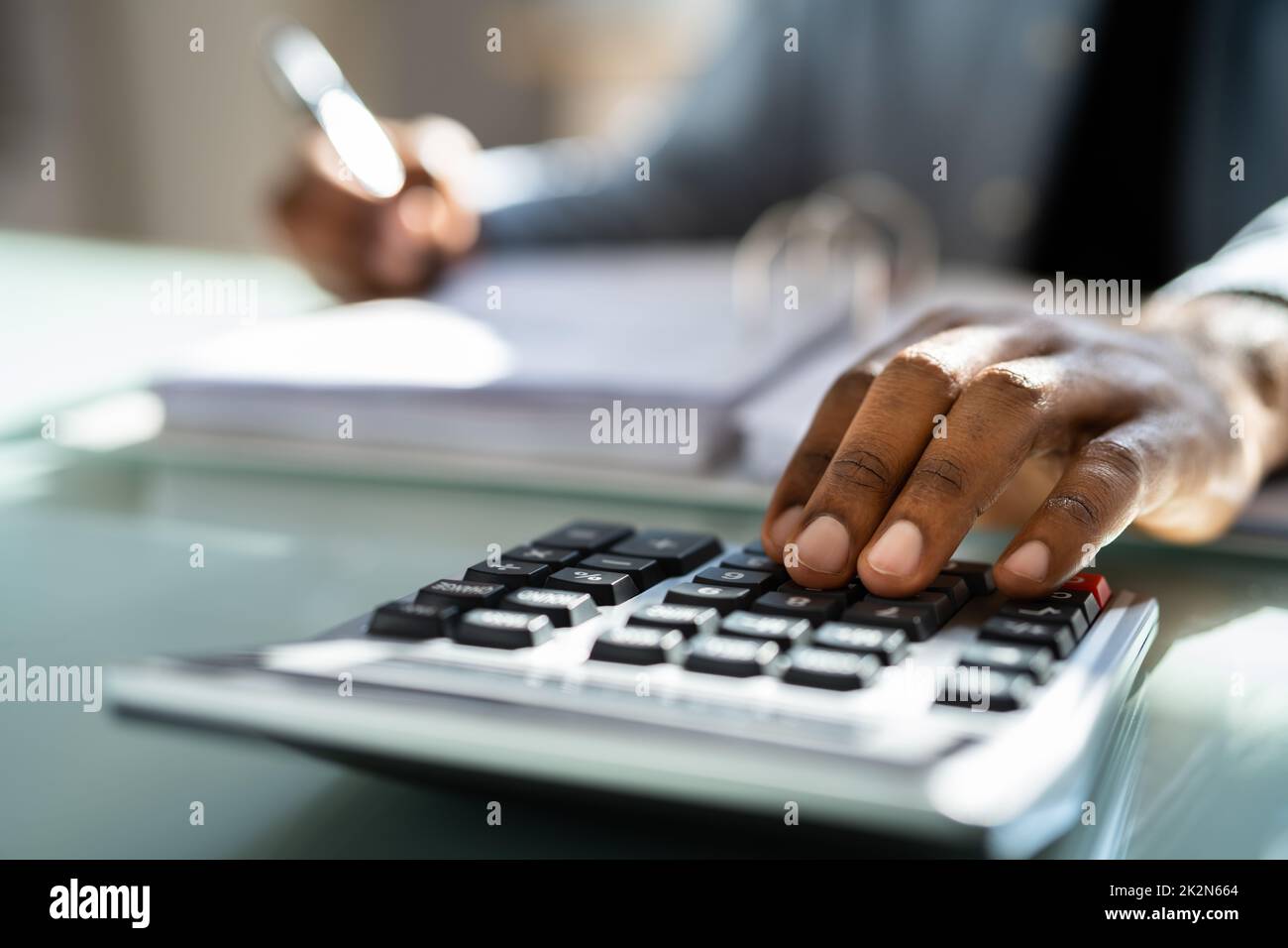 African American Male Accountant Using Calculator Stock Photo - Alamy