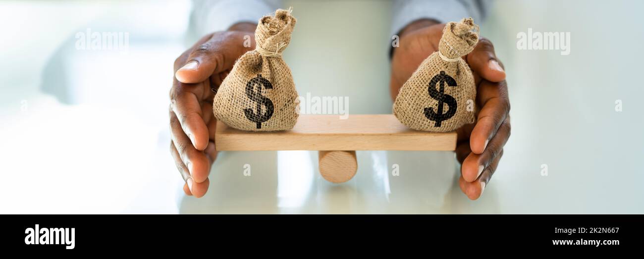 Money balance scales hi-res stock photography and images - Alamy