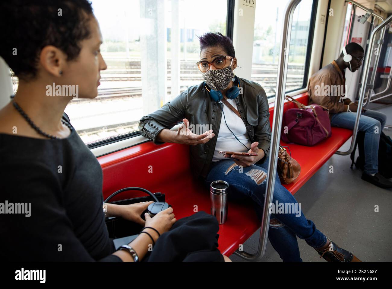 Passengers talking commuter train hi-res stock photography and images ...