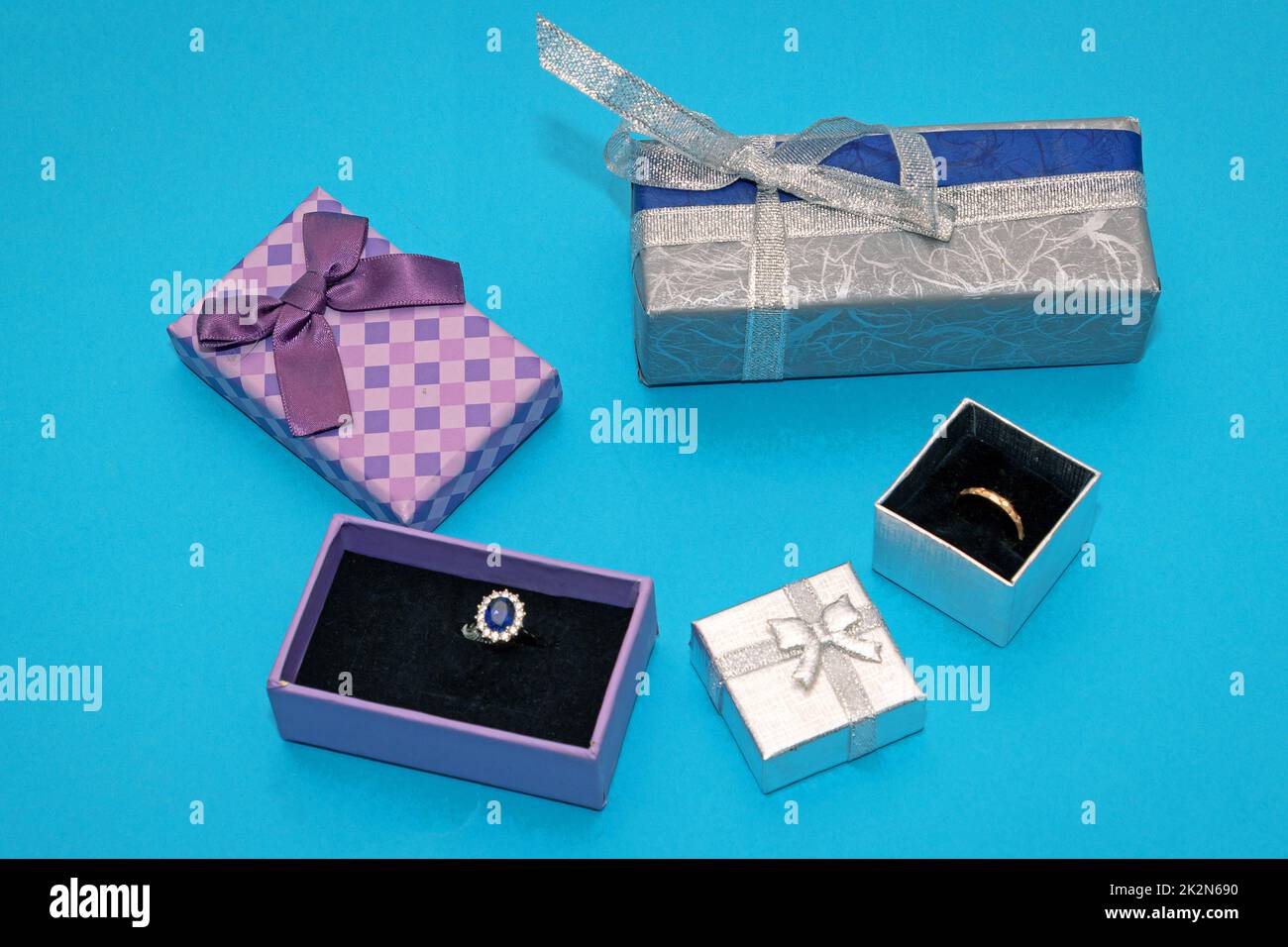 Open gift boxes with rings inside Stock Photo - Alamy