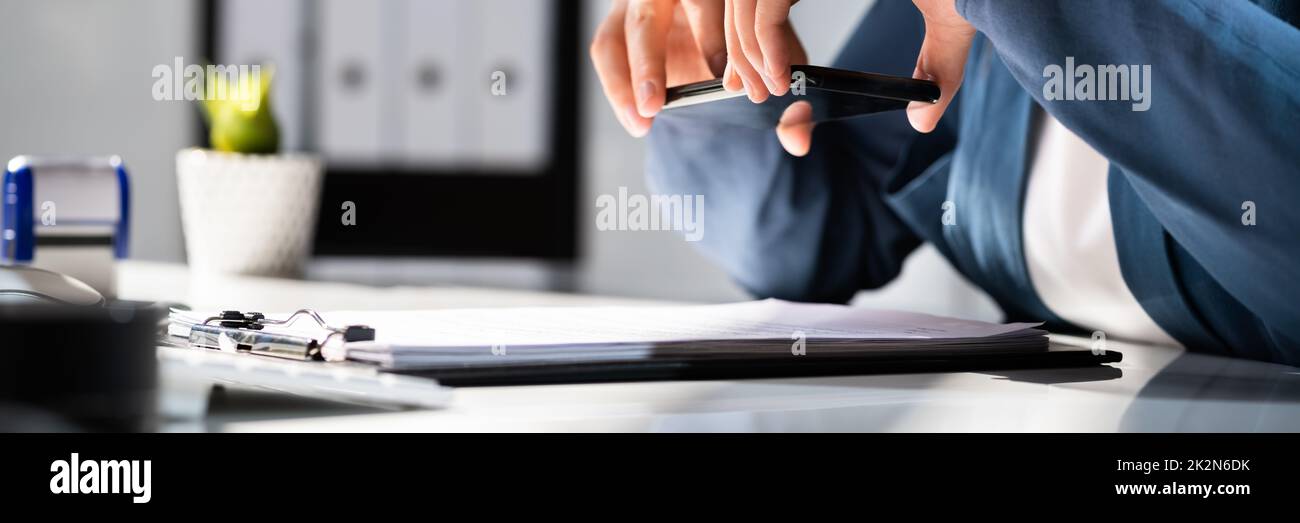 Remote Payroll Cheque Deposit Taking Picture Stock Photo - Alamy