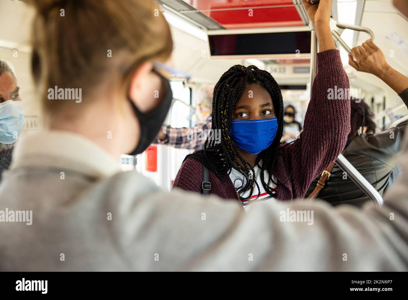 Riding a train with a face mask hi-res stock photography and images - Alamy