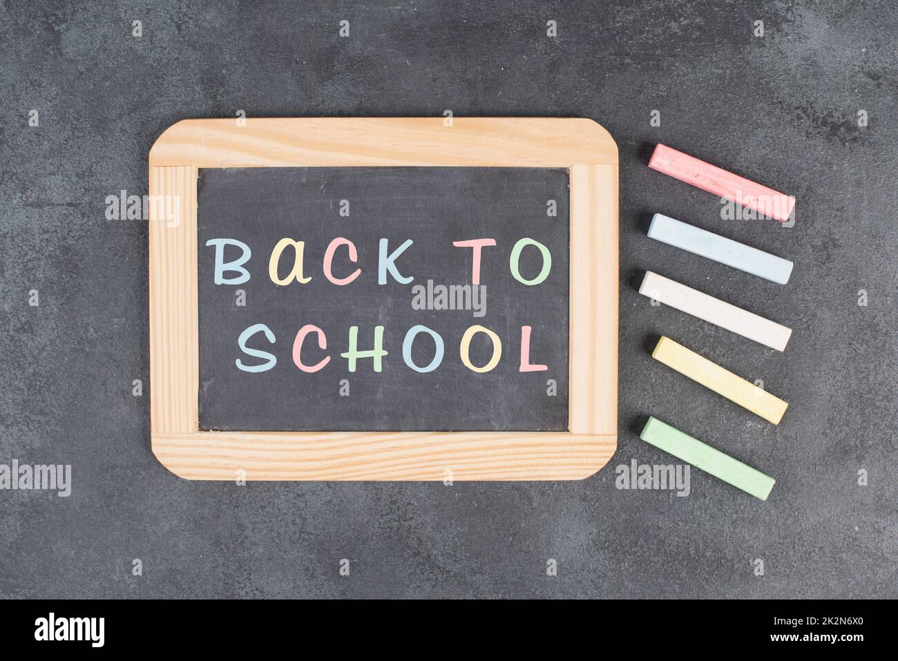 Chalkboard with the text back to school, education concept, colorful ...