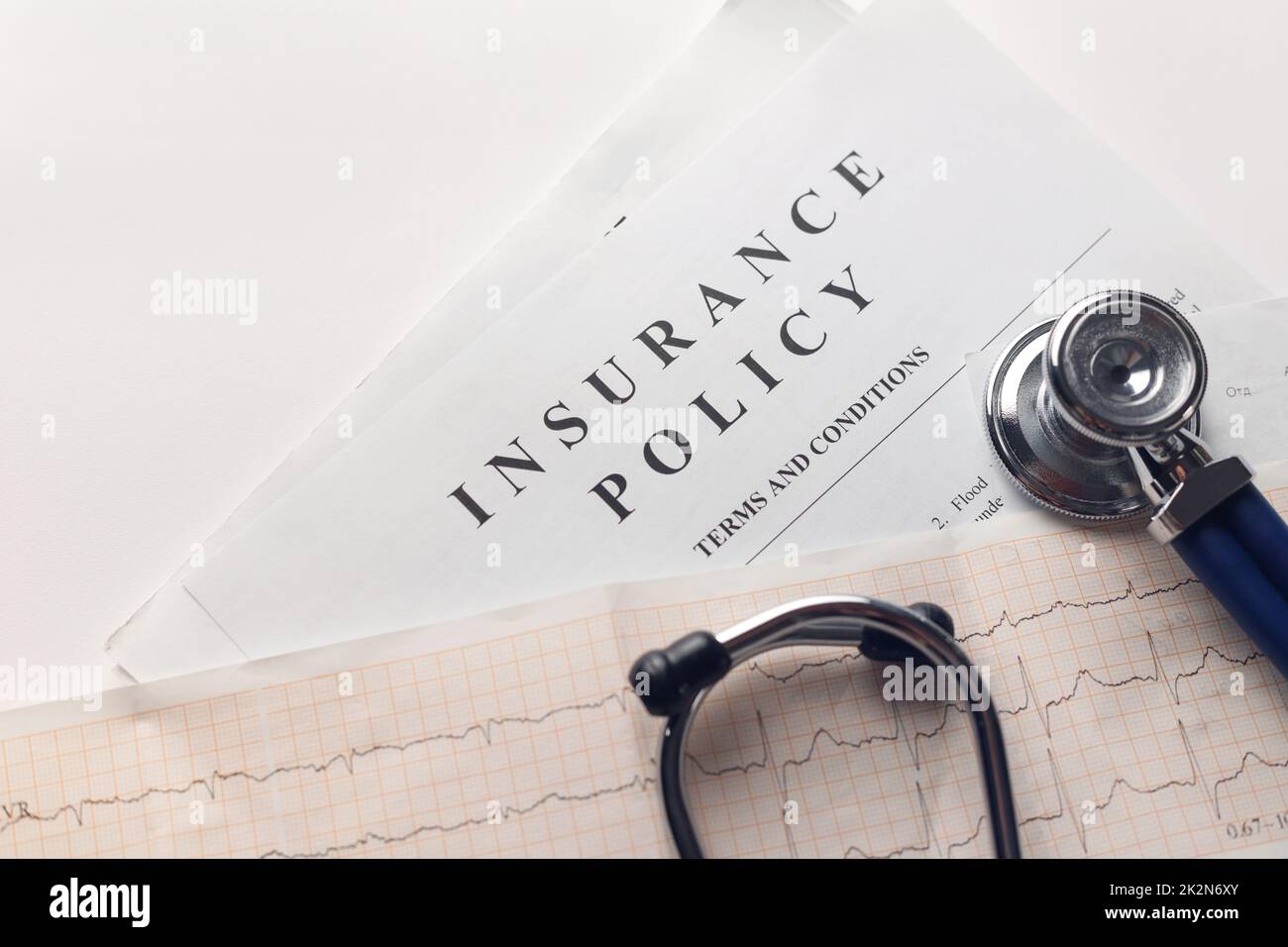 Health insurance form, medical stethoscope and cardiogram chart with ...