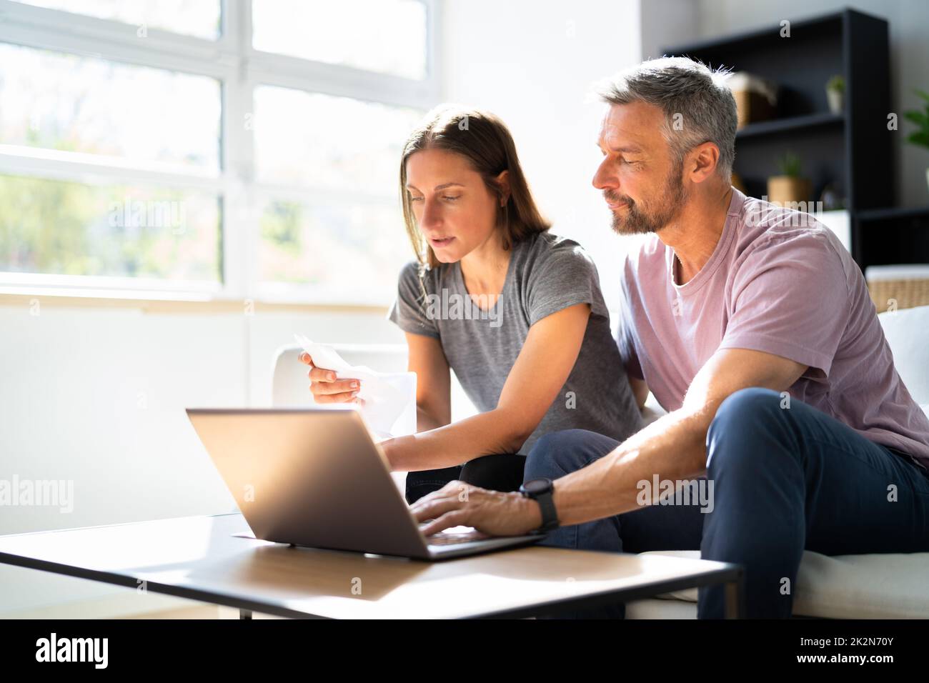 Couple Doing Taxes And Family Budget Stock Photo - Alamy