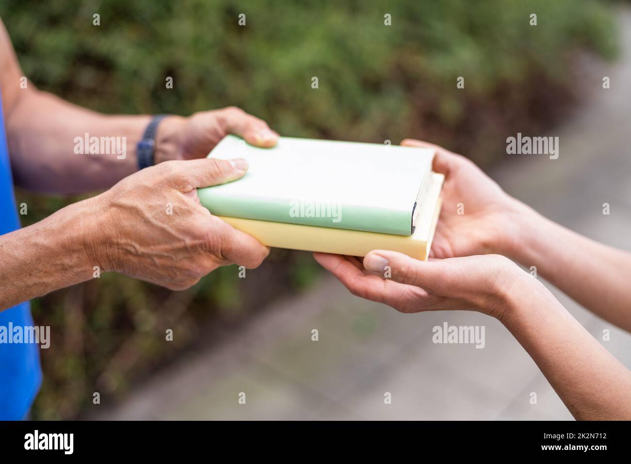 Female student sharing book hi-res stock photography and images - Alamy