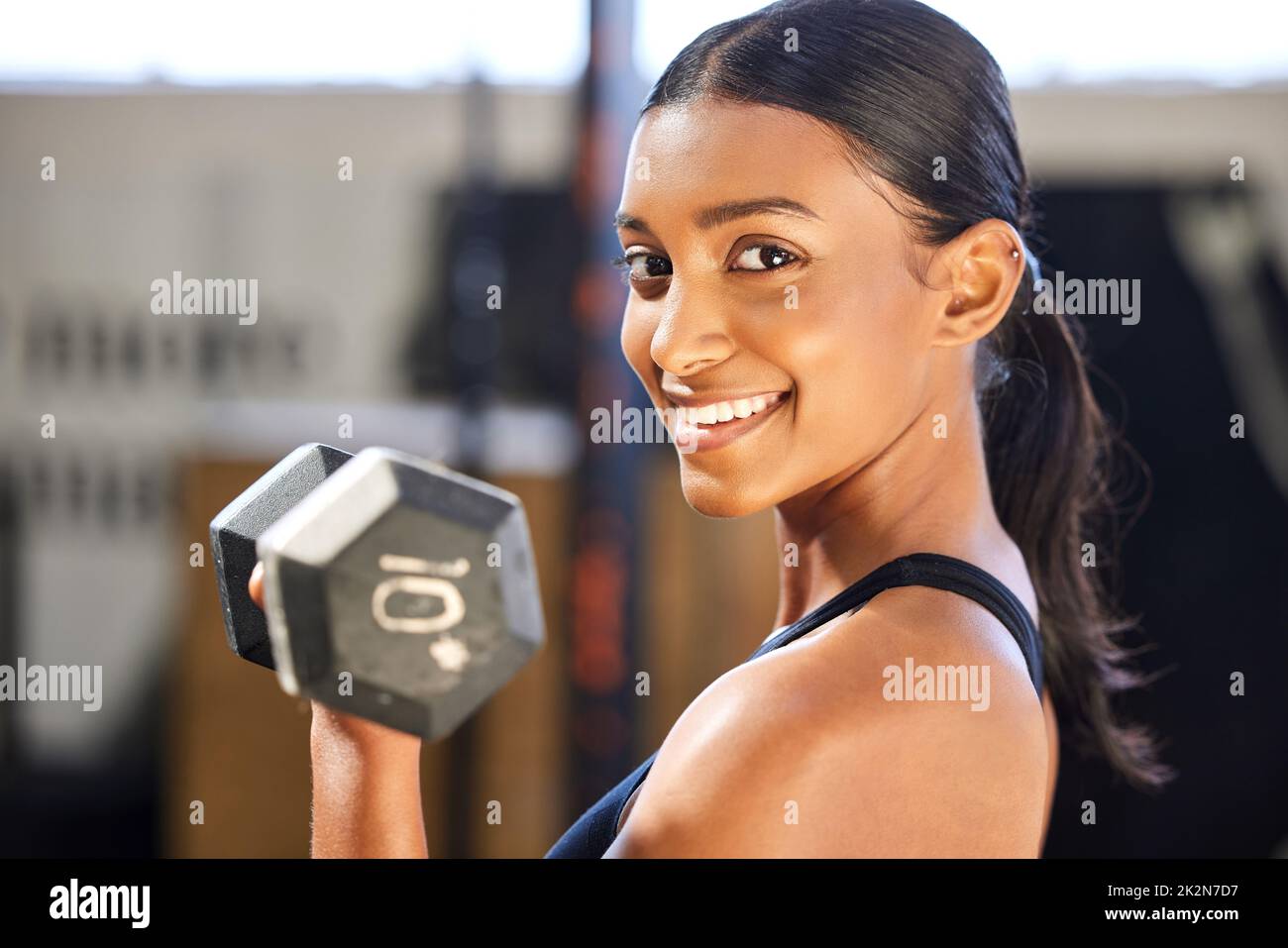 These bad boys are getting lighter by the day. Shot of a young woman ...
