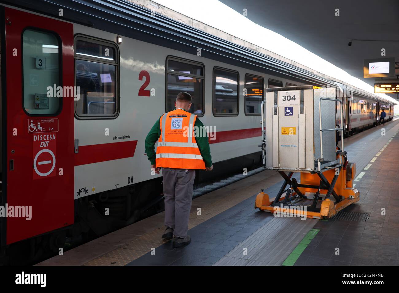 Naples, Italy - September 21, 2022: In the train station two operators ...
