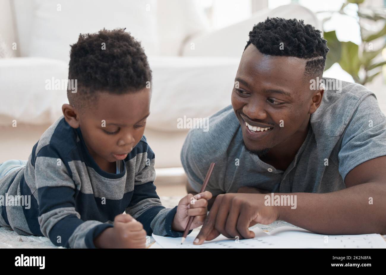 Father helping son draw hi-res stock photography and images - Alamy