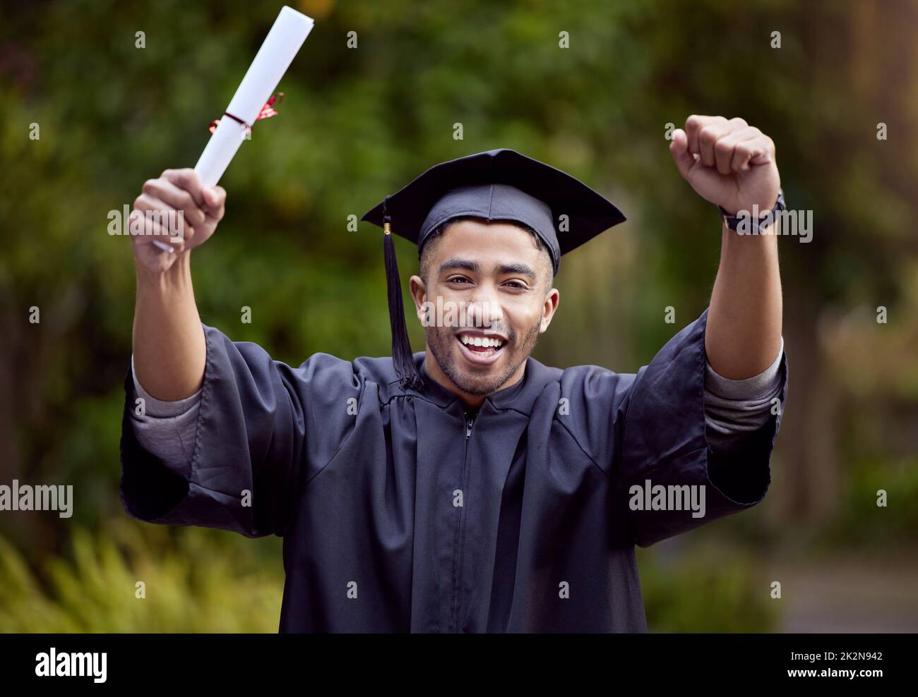 Young man in graduation robe hi-res stock photography and images - Alamy