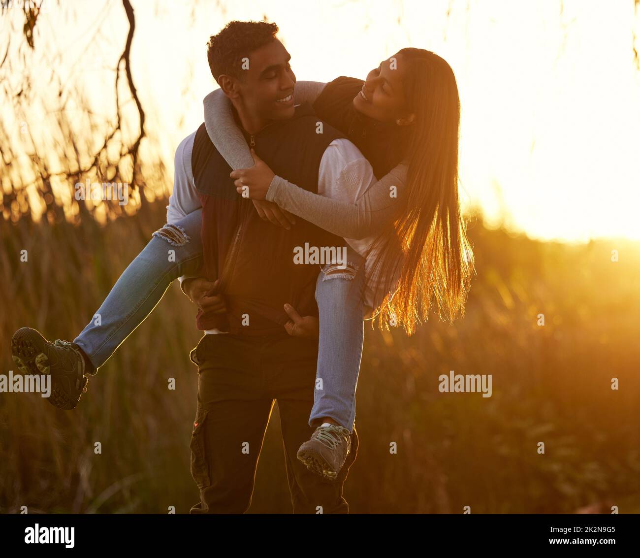 Young man giving piggyback ride hi-res stock photography and images - Alamy