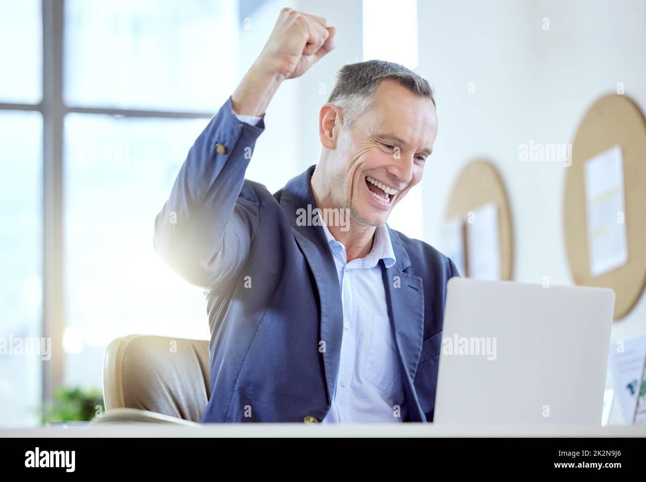 Businessman cheering at office desk hi-res stock photography and images ...
