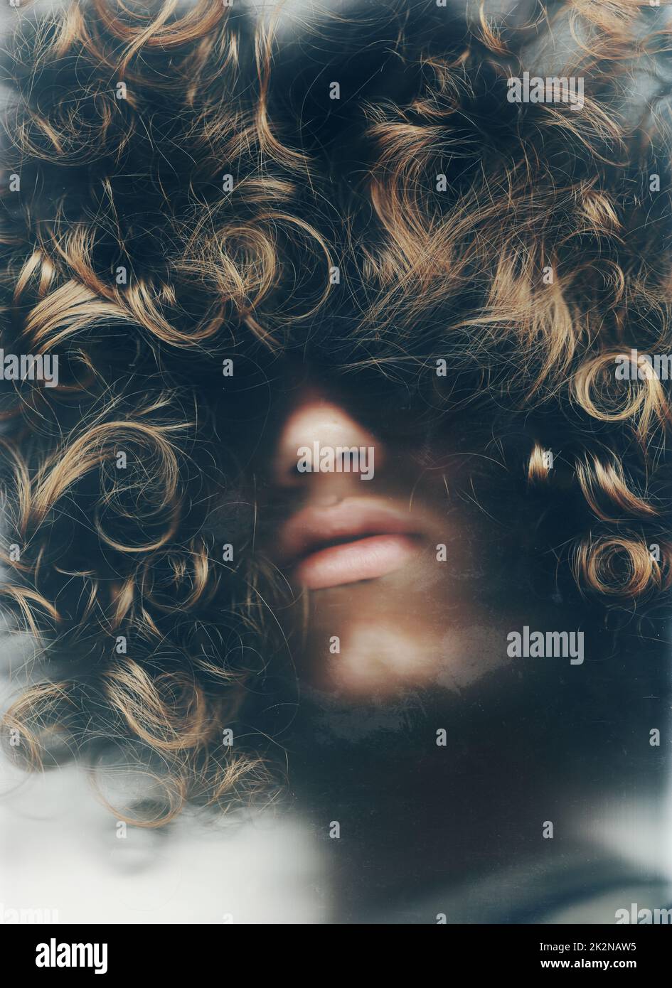 Young man with wavy hair hi-res stock photography and images - Alamy