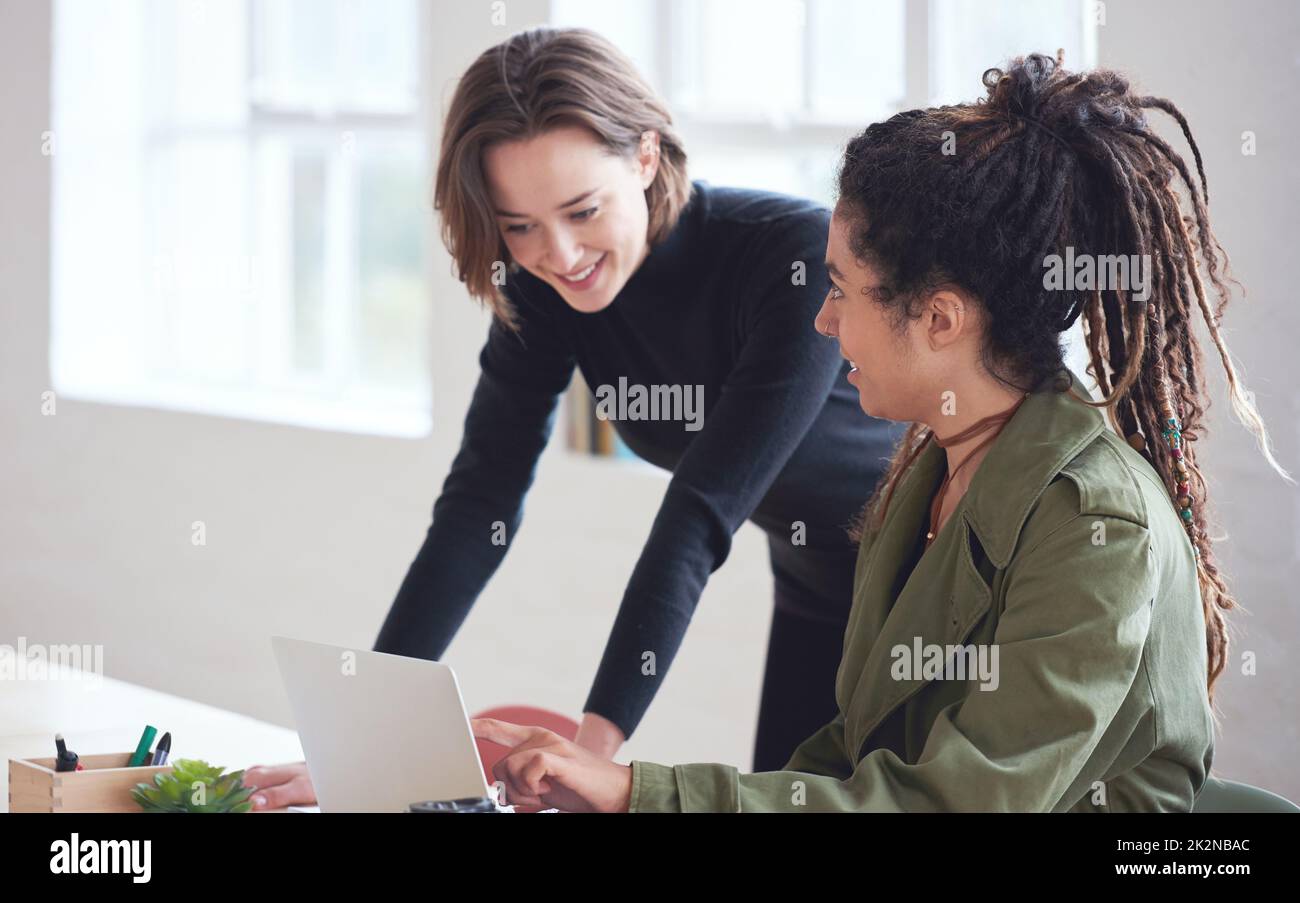 Two business women students using laptop computer team leader woman ...