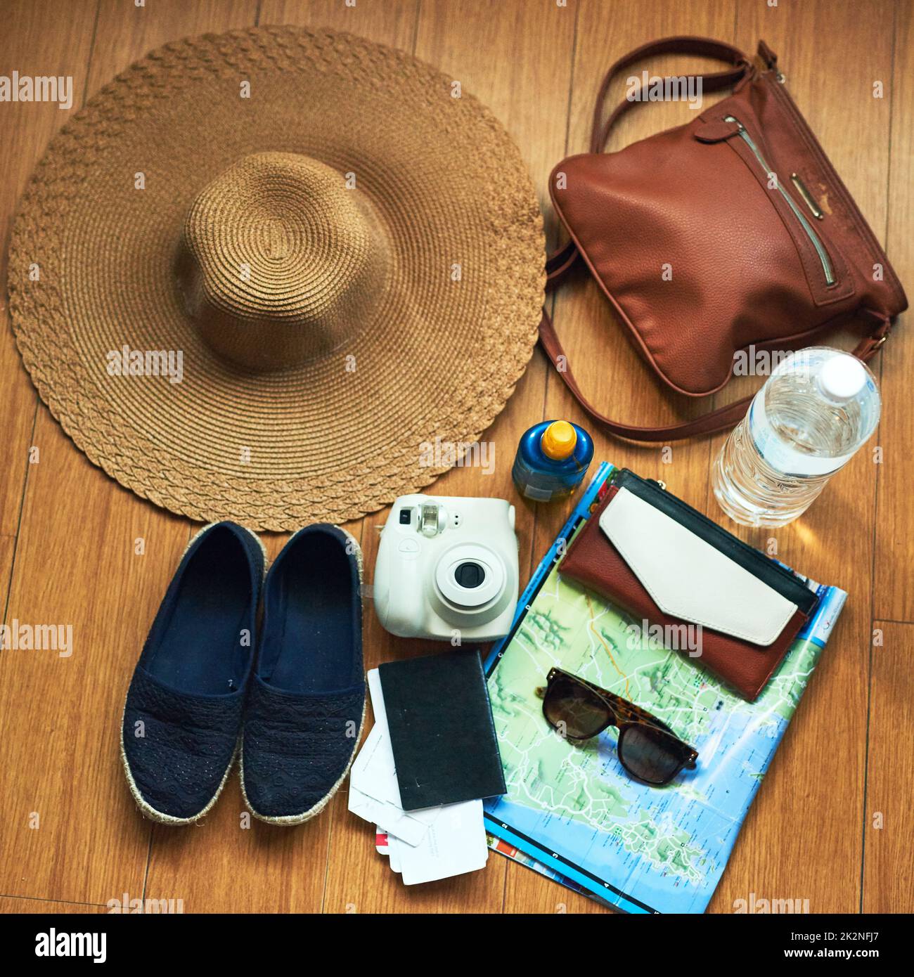 The tourists essentials. High angle shot of travelling essentials on a ...