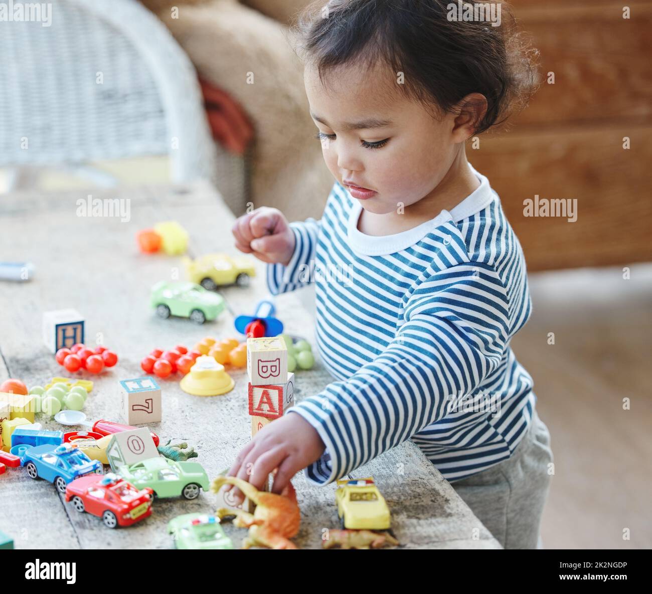 These are my favourite things to play with. Shot of an adorable little ...